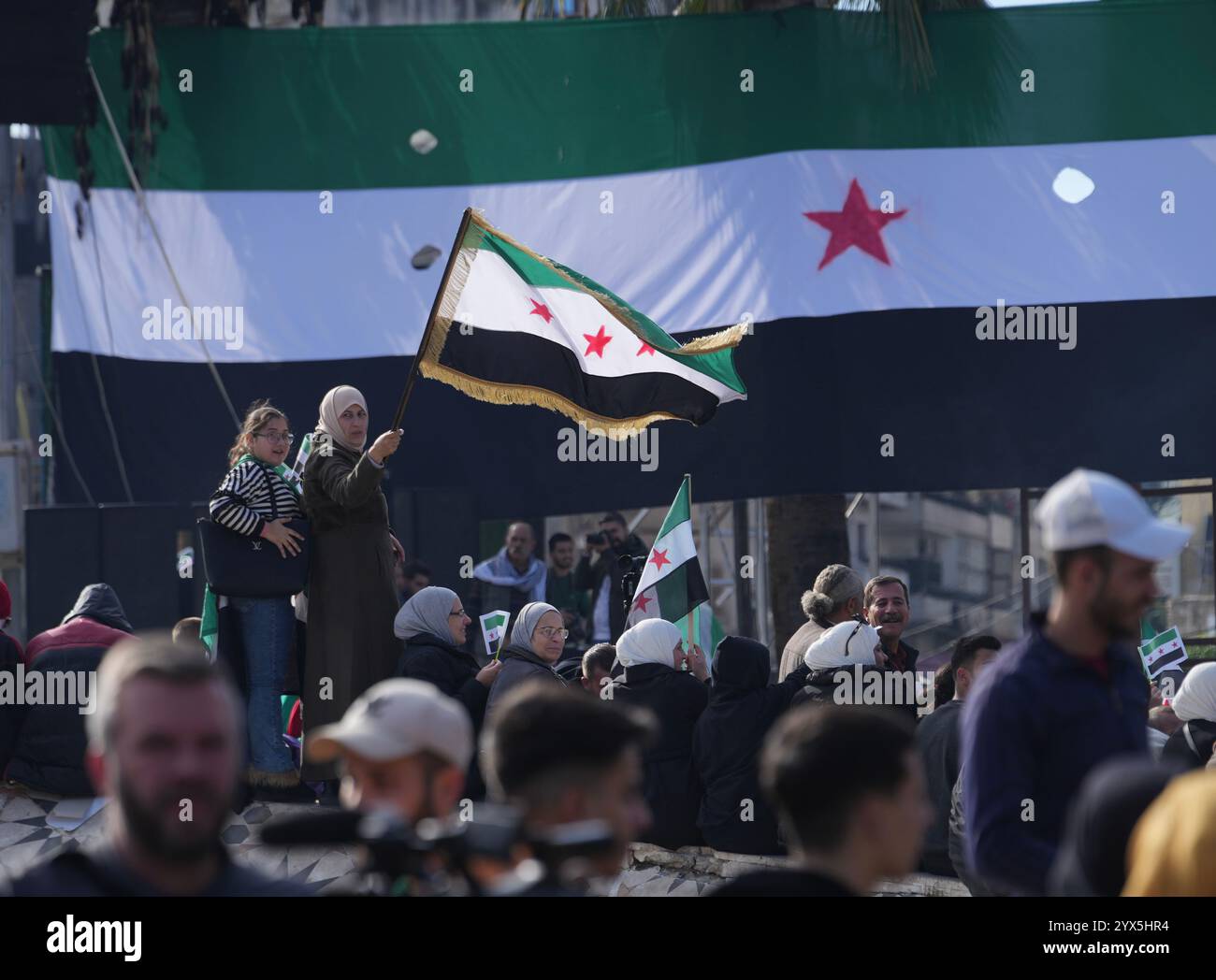 People celebrate in Latakia, Syria after the fall of Syria's Bashar ...