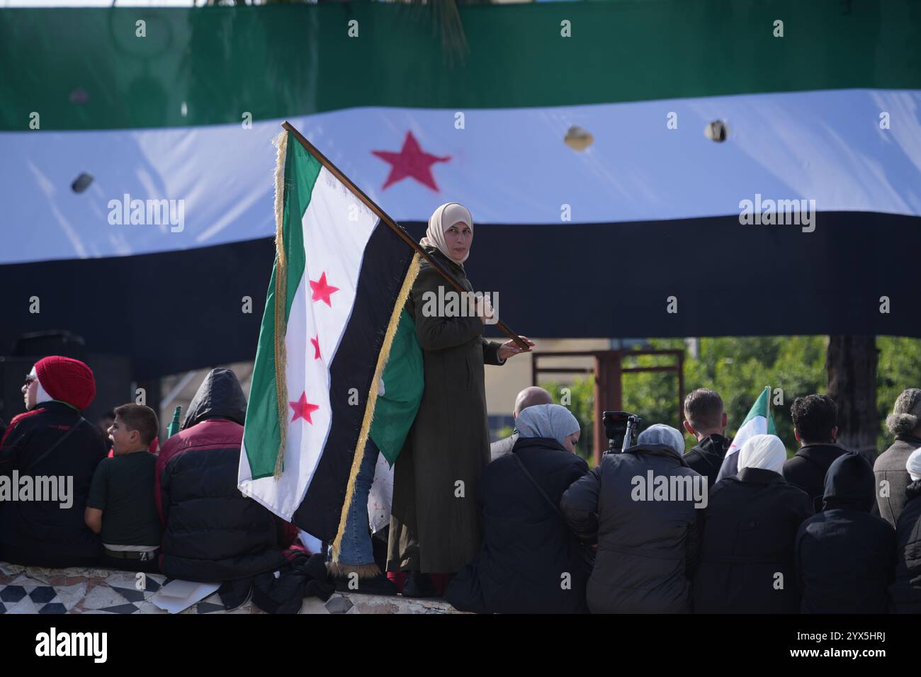 People celebrate in Latakia, Syria after the fall of Syria's Bashar ...