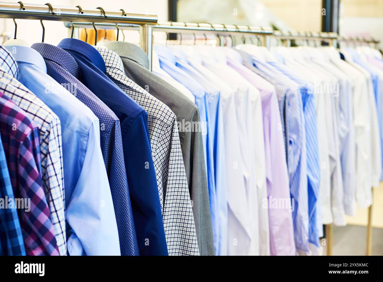 Men's shirts in the clothing store Stock Photo - Alamy