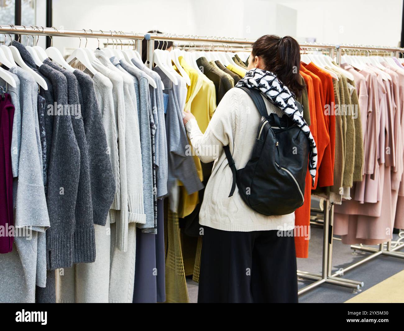 Woman chooses clothes in store hi-res stock photography and images - Alamy