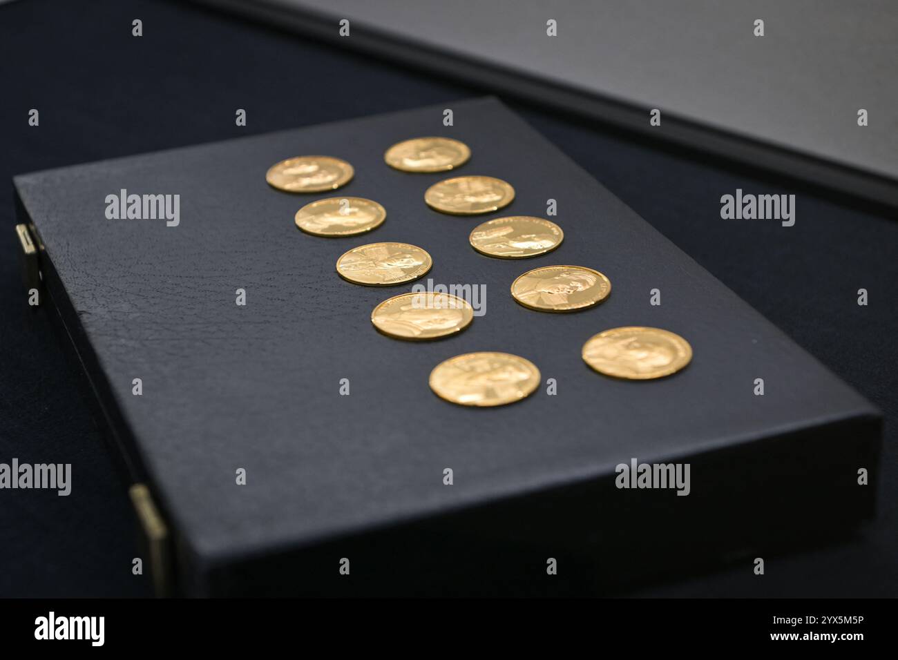 Paris, France. 13th Dec, 2024. This photograph shows unique coins ...