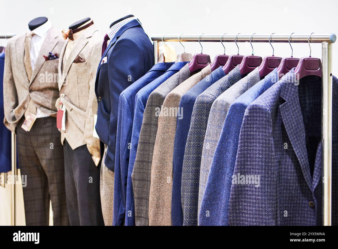 Men's suits in the clothing store Stock Photo - Alamy