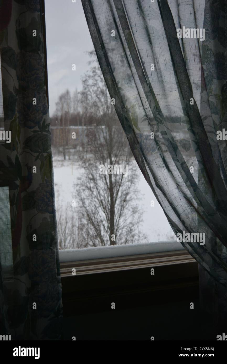 A wooden window made of natural wood is located in a Finnish house ...