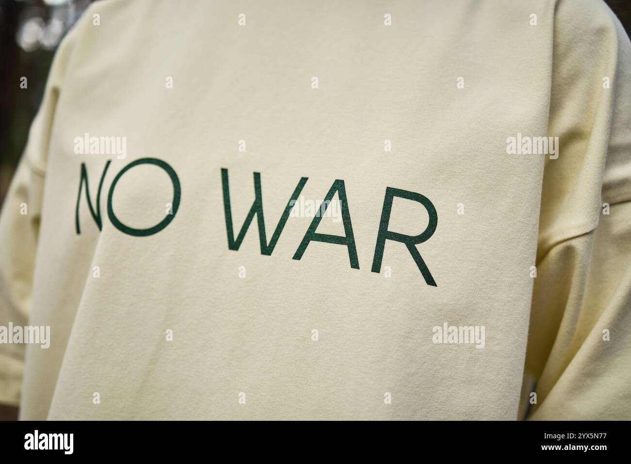 Zoomed-in view of a T-shirt displaying a No War message, representing ...