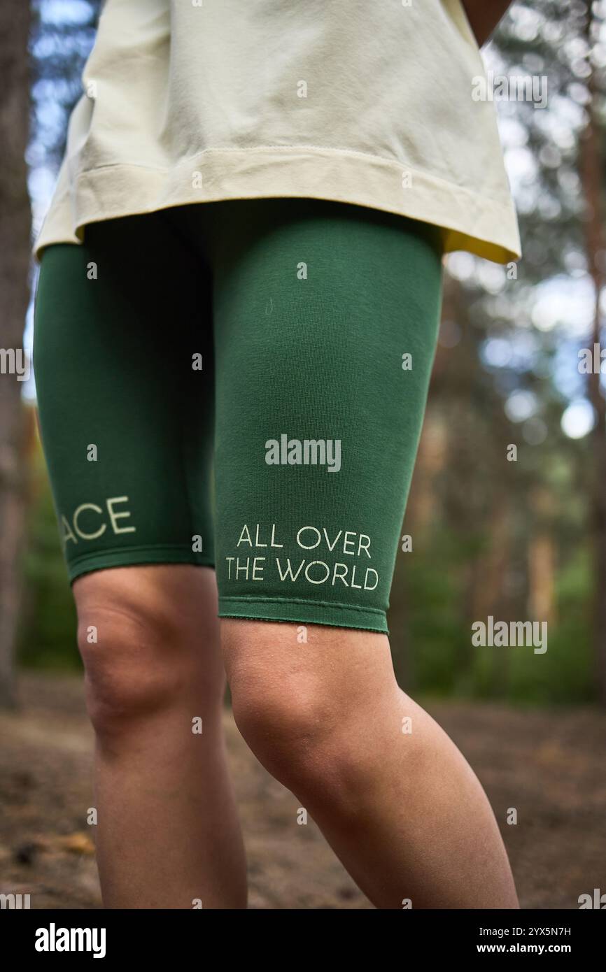 Individual wearing green shorts with text All Over the World relaxing ...