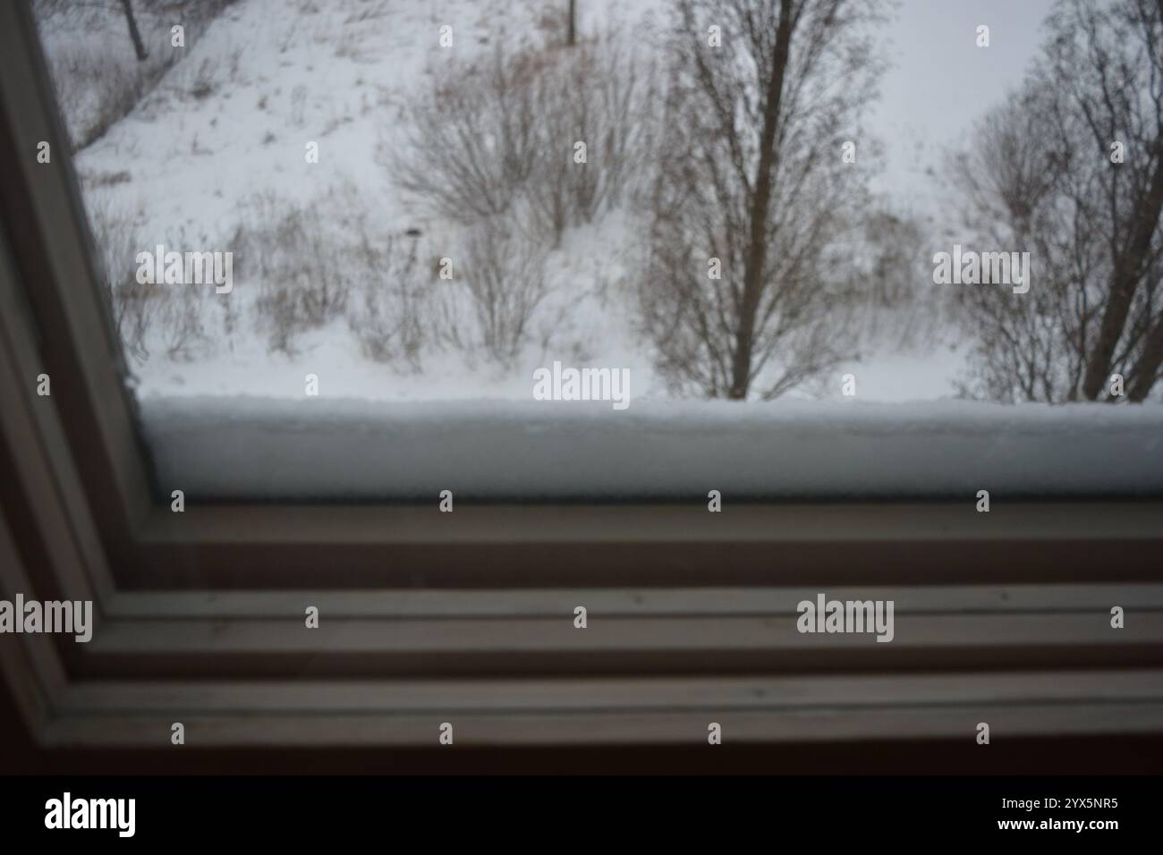 A wooden window made of natural wood is located in a Finnish house ...