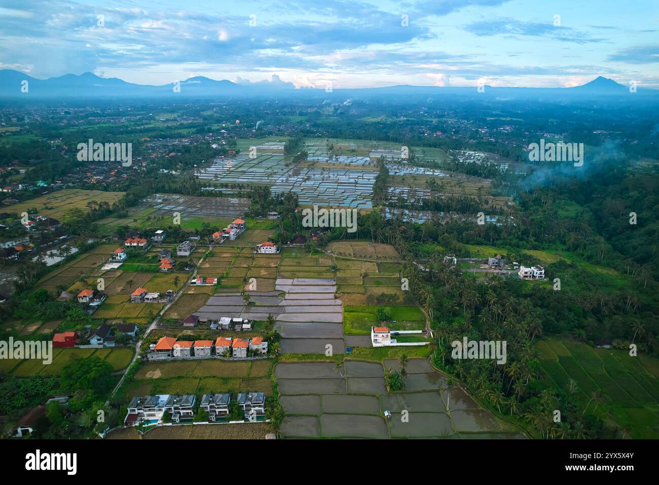 Aerial view of rice plantations and a hill village from a drone. Rice ...
