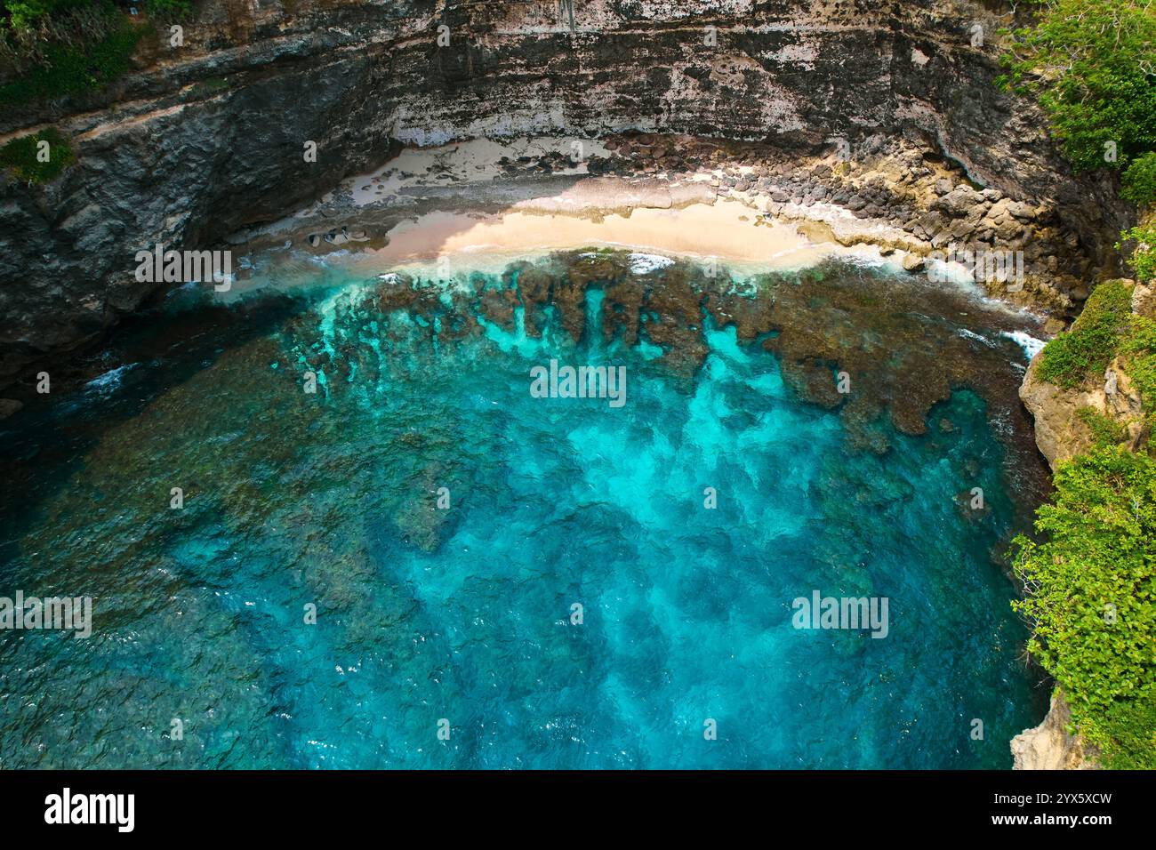 Cliff broken by wave of ocean formed perfect paradise untouched beach ...