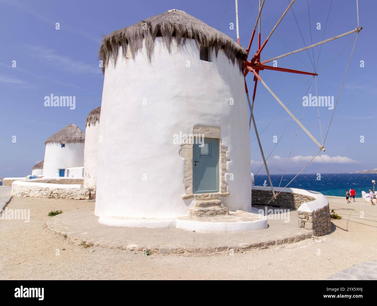 Traditional Greek windmills on Mykonos island under cloudy sky. Aerial ...