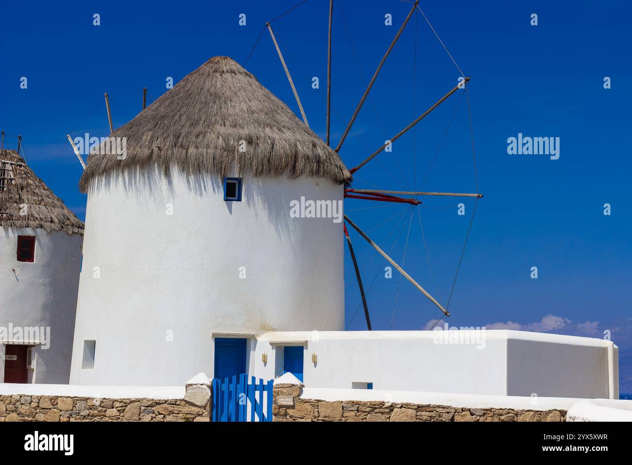 Traditional Greek windmills on Mykonos island under cloudy sky. Aerial ...