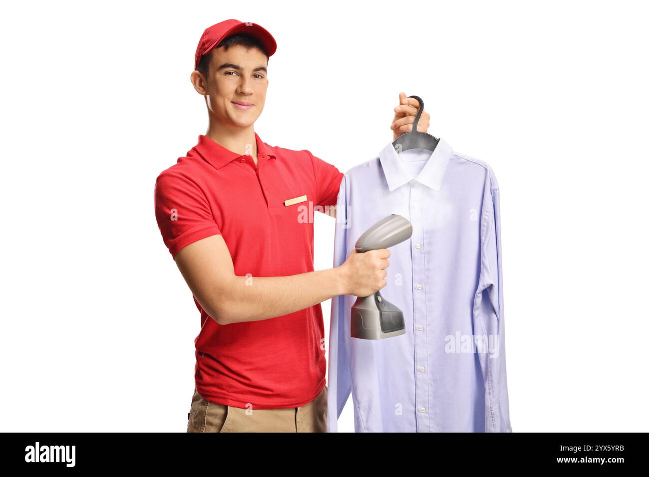 Dry clean worker ironing a shirt with a hand steam iron isolated on ...