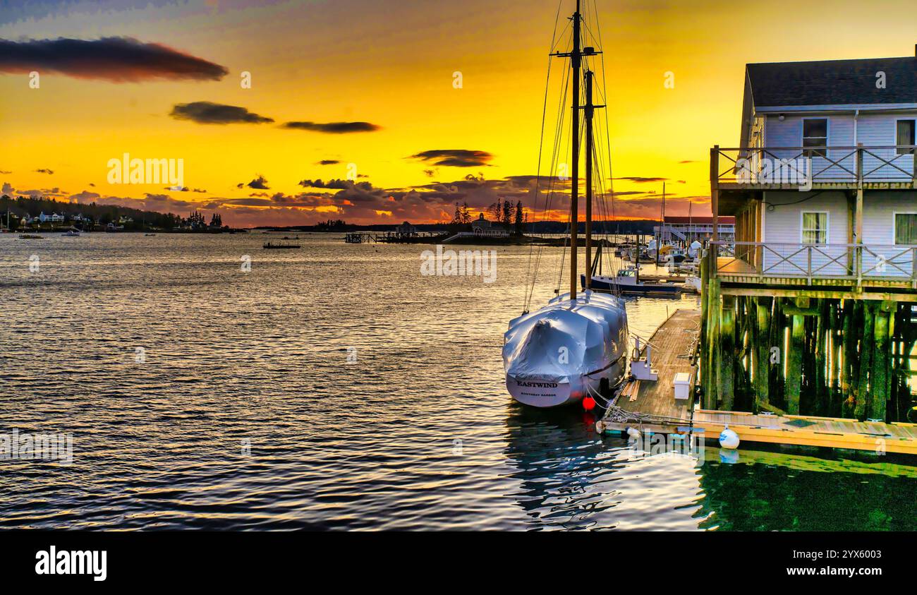 November 29, 2024 Booth Bay Harbor, Maine, USA A covered sailboat tied ...