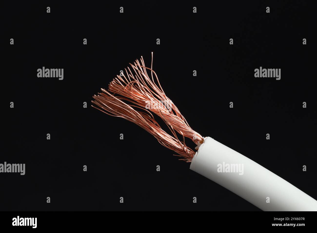 White stripped electrical wire on black background, closeup Stock Photo ...
