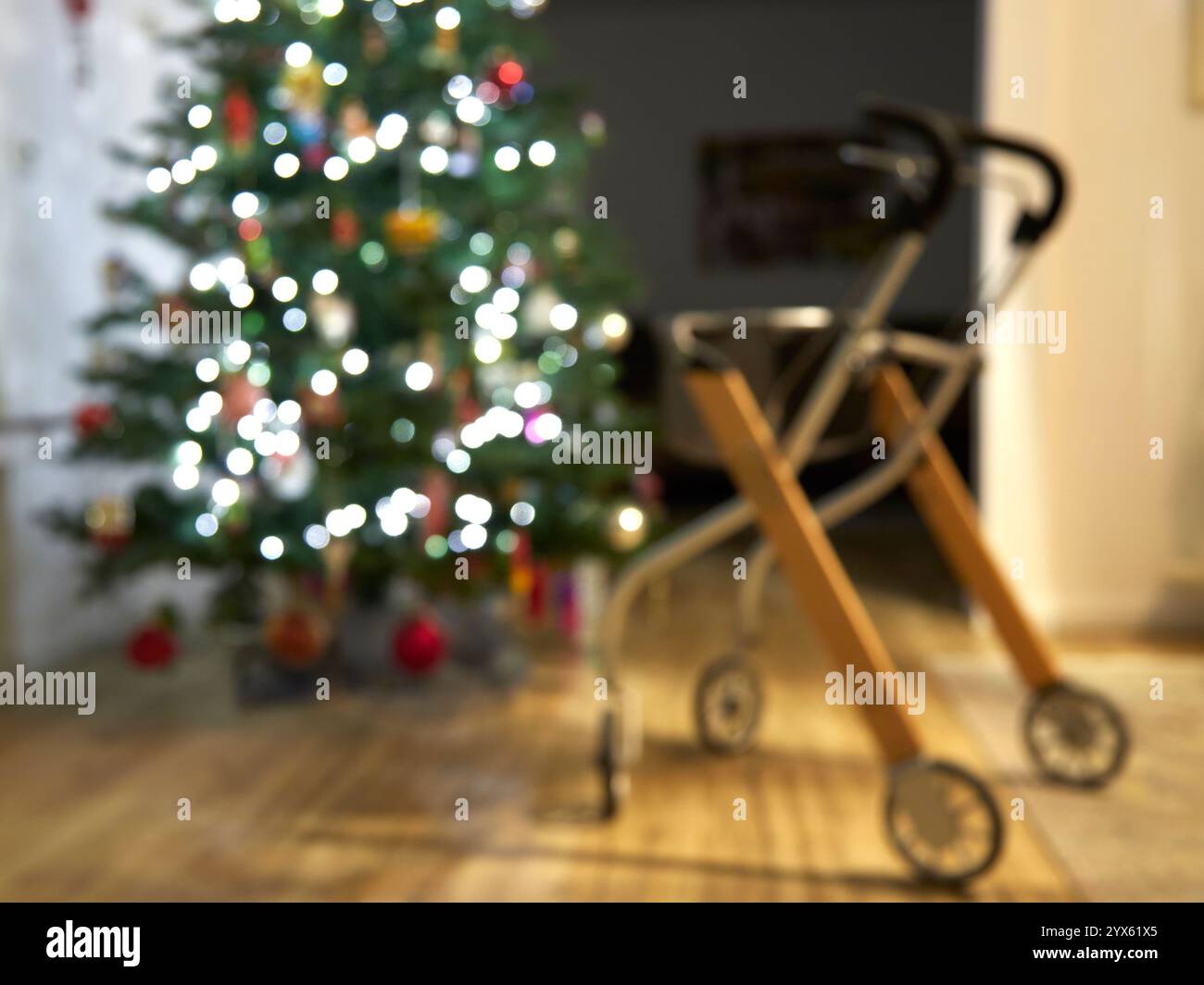 walker in front of a decorated Christmas tree, everything kept in blur ...