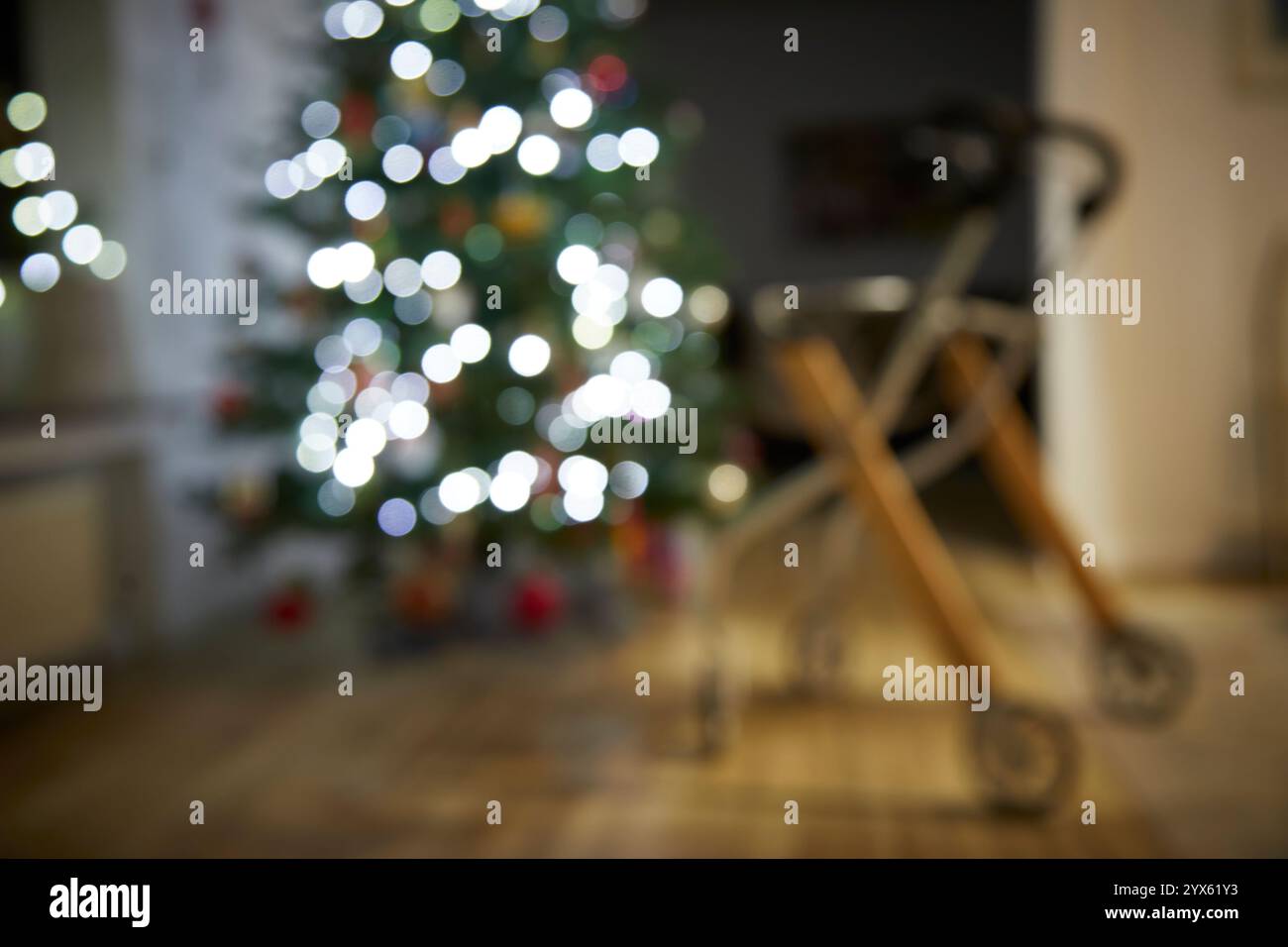 walker in front of a decorated Christmas tree, everything kept in blur ...