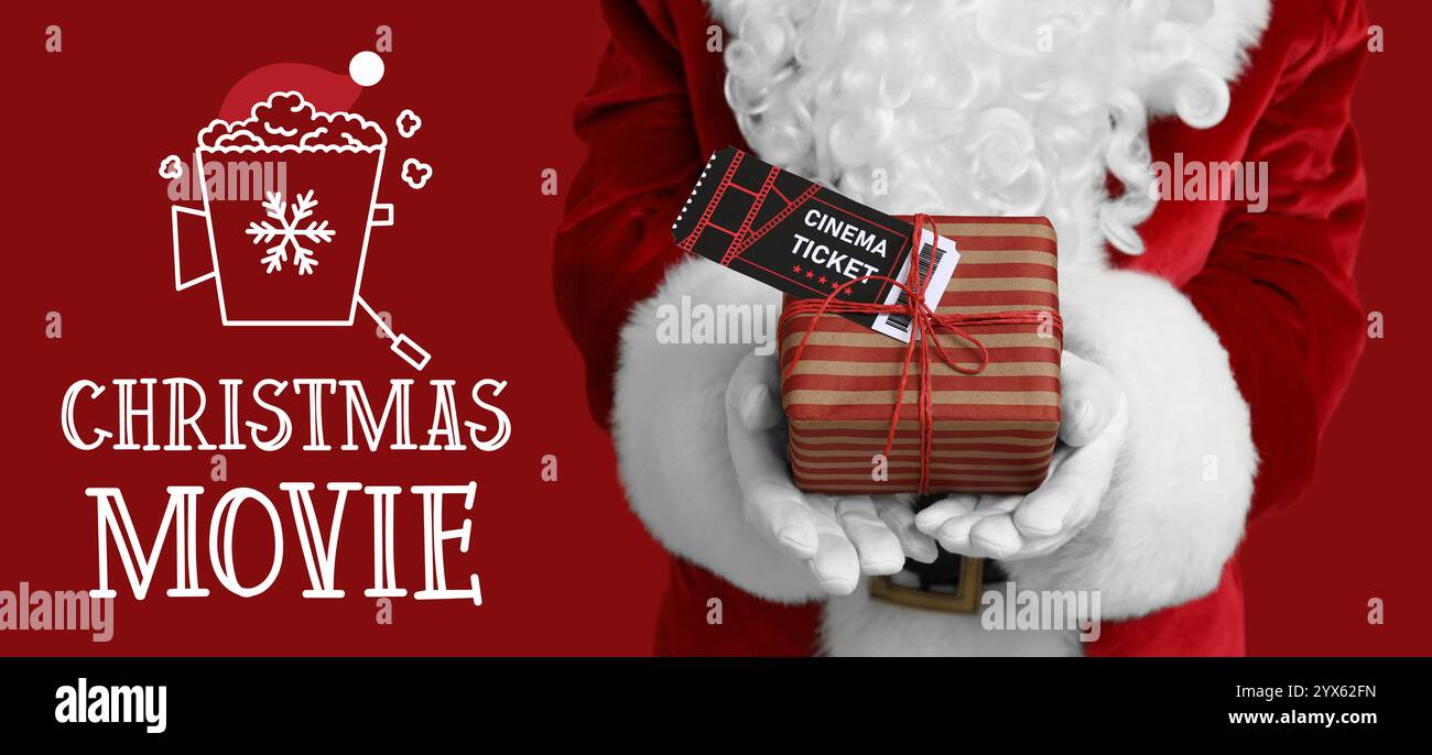 Santa Claus with cinema ticket and gift box on red background, closeup ...