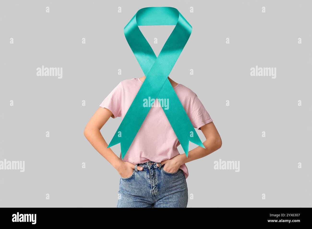 Woman with awareness ribbon instead of head on grey background ...