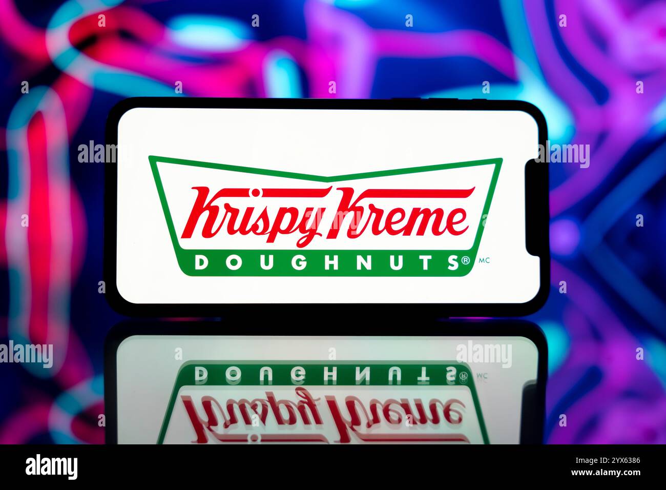 In this photo illustration, the Krispy Kreme logo is seen displayed on ...