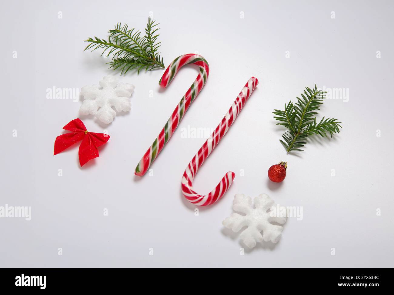 Candy canes, fir branches and Christmas decorations on white background Stock Photo - Alamy