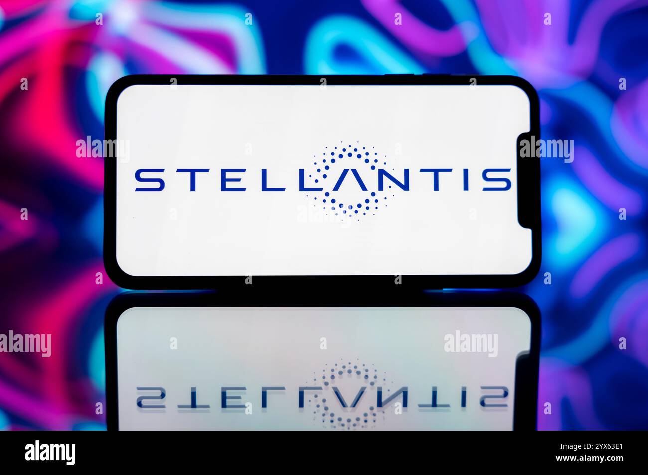 In this photo illustration, the Stellantis logo is seen displayed on a ...