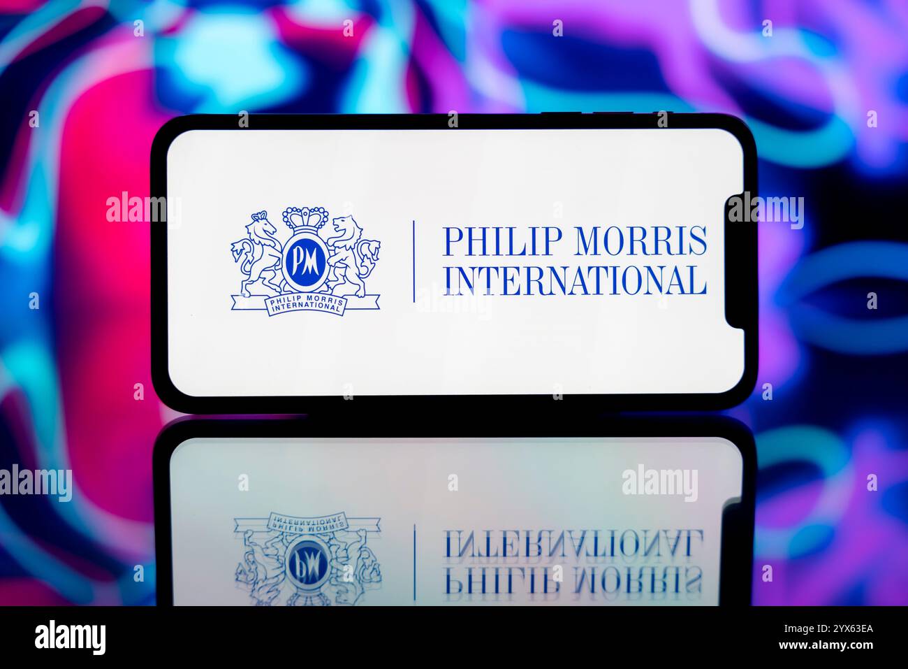 In this photo illustration, the Philip Morris international logo is ...