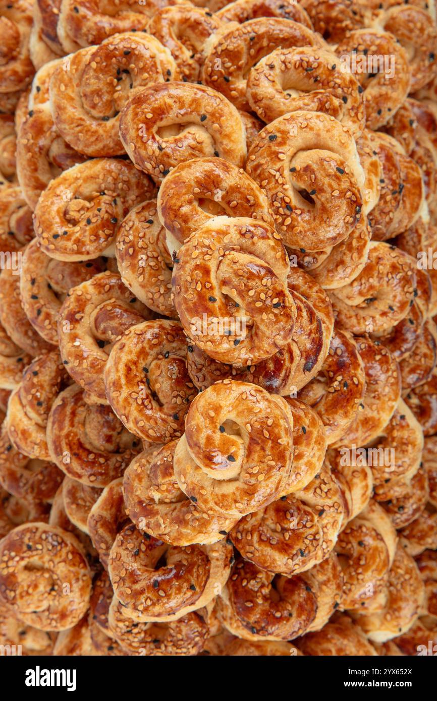 Salty pastry snack. Homemade whole meal pretzels with sesame and salt ...