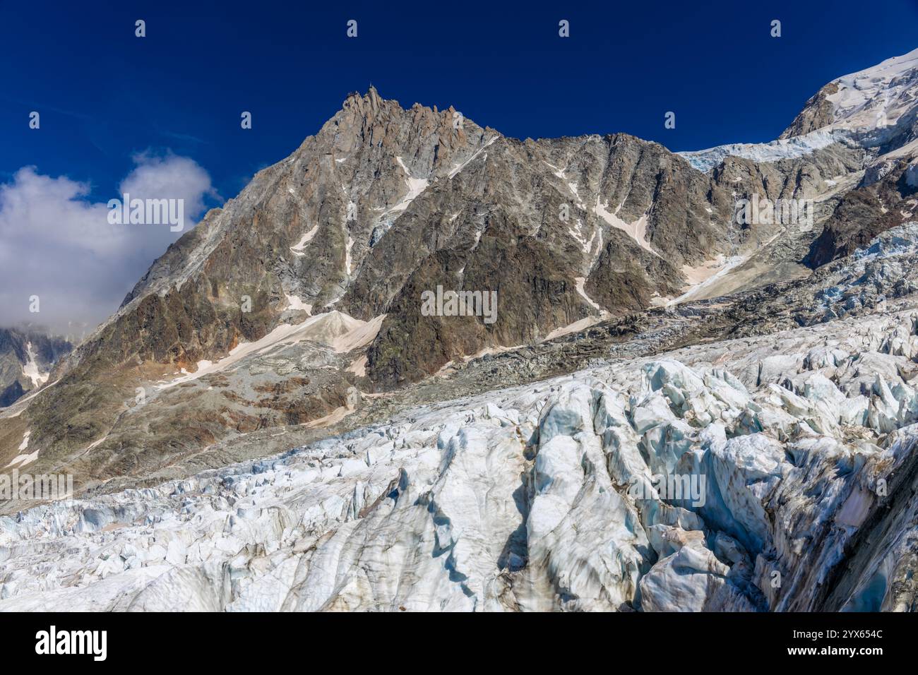 Aiguille du Midi peak in the Alps. Chamonix valley landscape of a prominent rocky towering ...