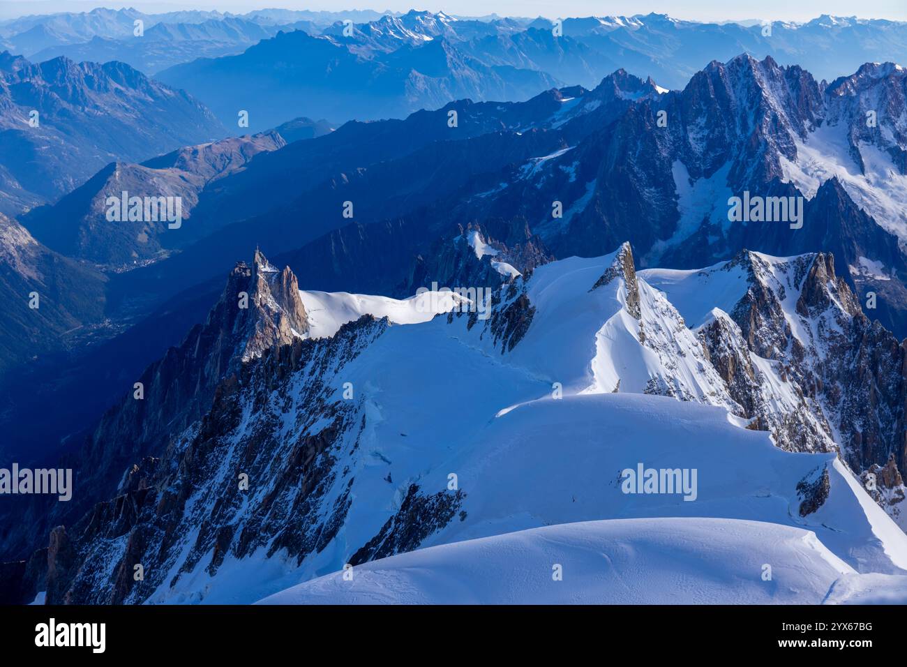 Aiguille du Midi peak in the Alps. Chamonix valley landscape of a prominent rocky towering ...
