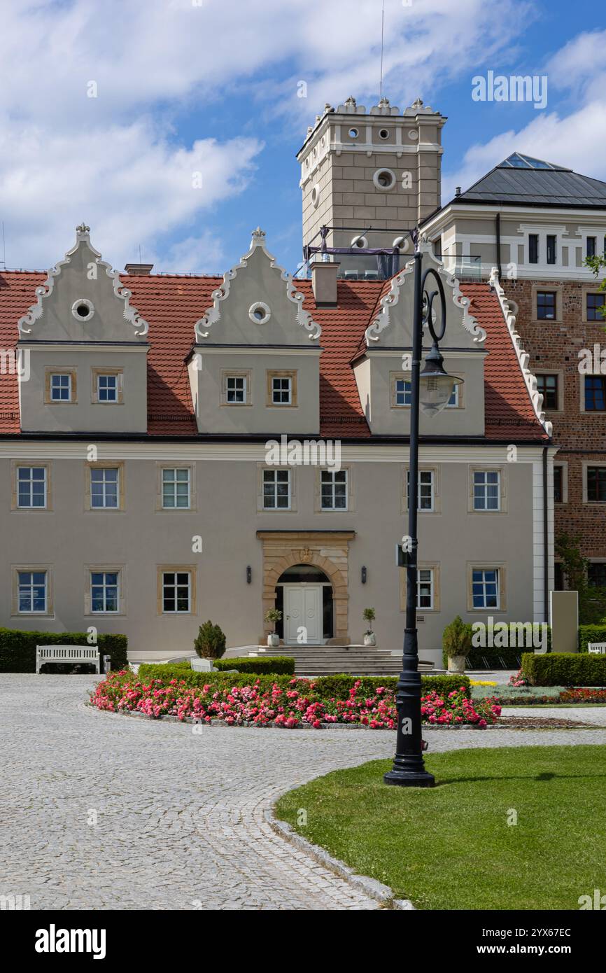 Elegant historic building with decorative gabled roofs, cobblestone ...