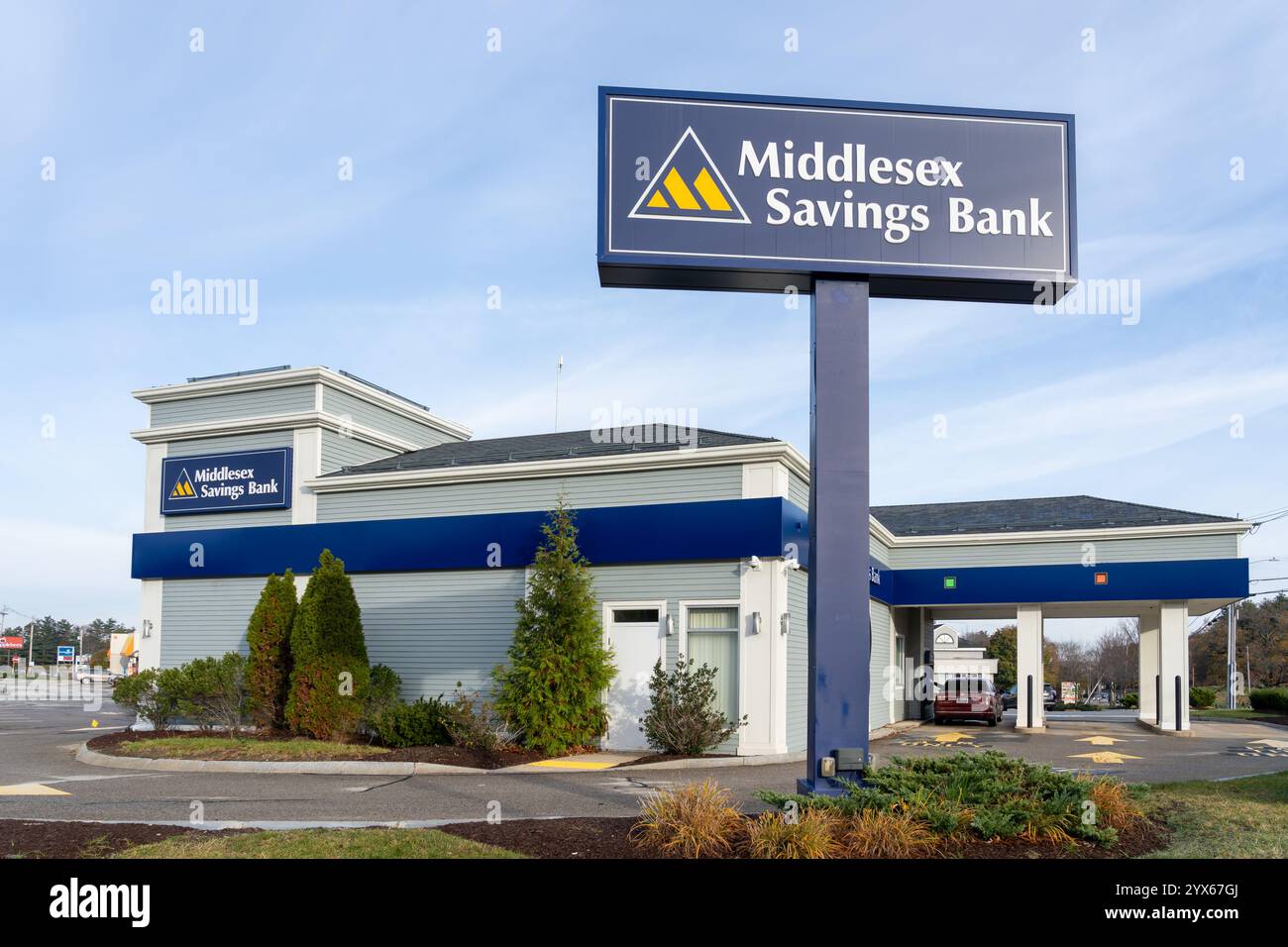 A Middlesex Savings Bank pole sign with the blue sky background ...