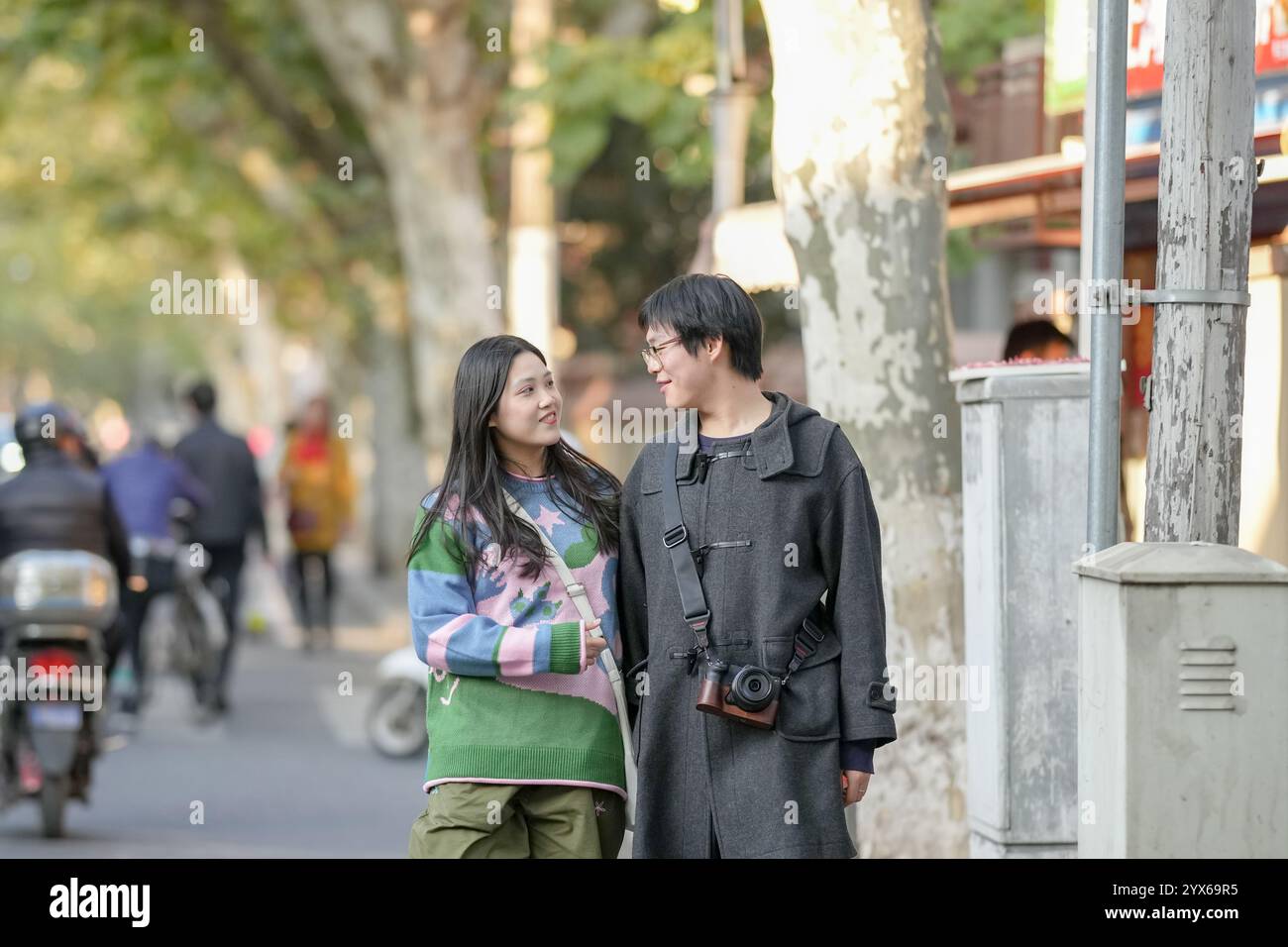 Young asian couple walks hi-res stock photography and images - Alamy