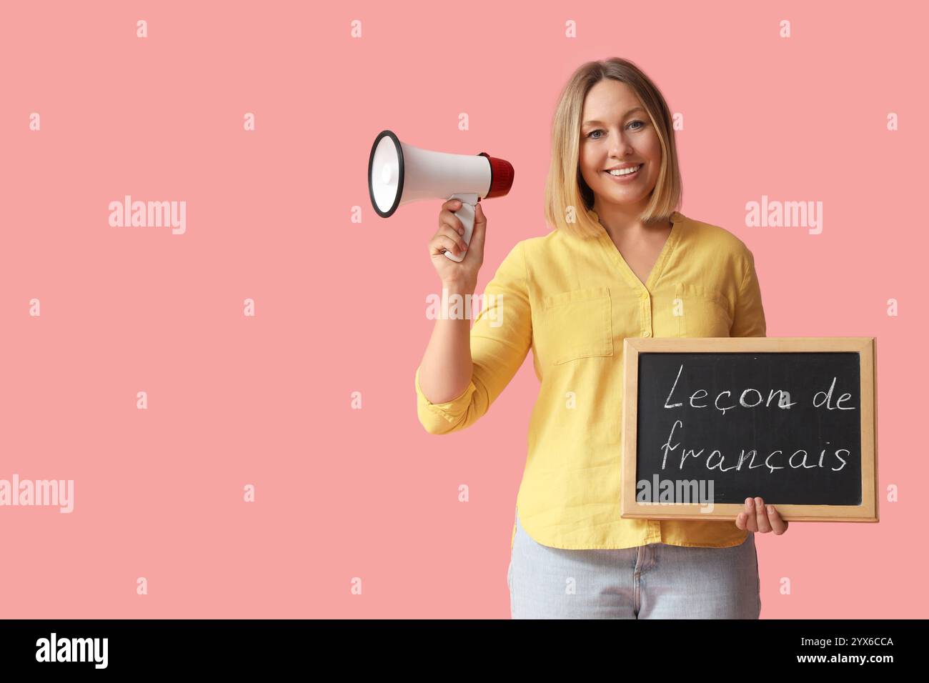 Female French language teacher with small blackboard and megaphone on ...