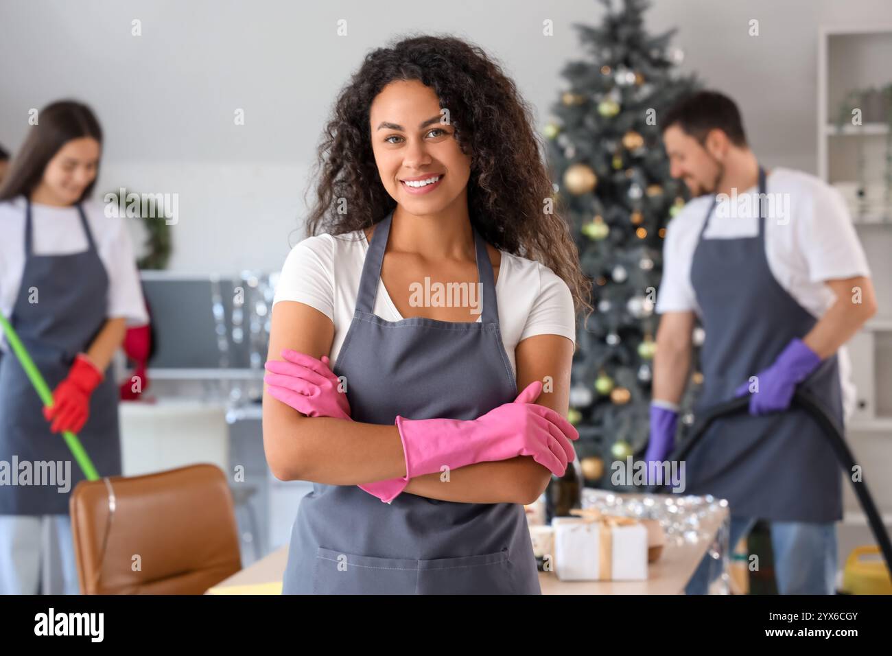 Female African-American janitor in office after New Year party Stock ...