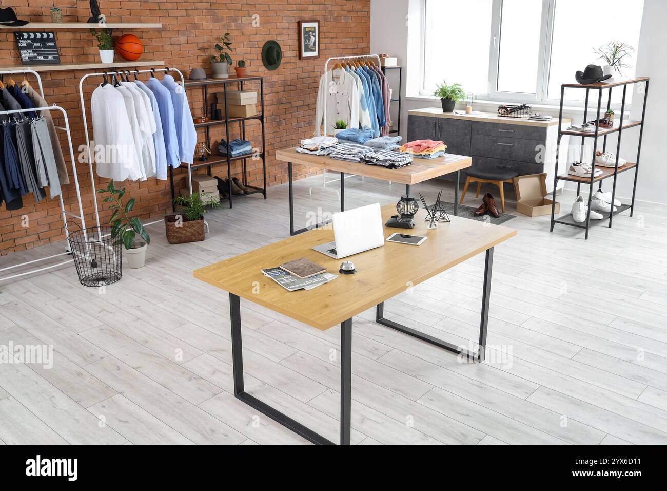 Interior of men's clothing store with shelf units and tables Stock ...