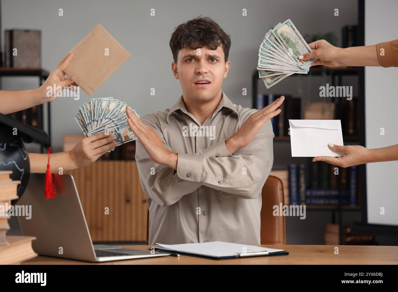 Male teacher refusing to take bribe in classroom. Corruption concept ...