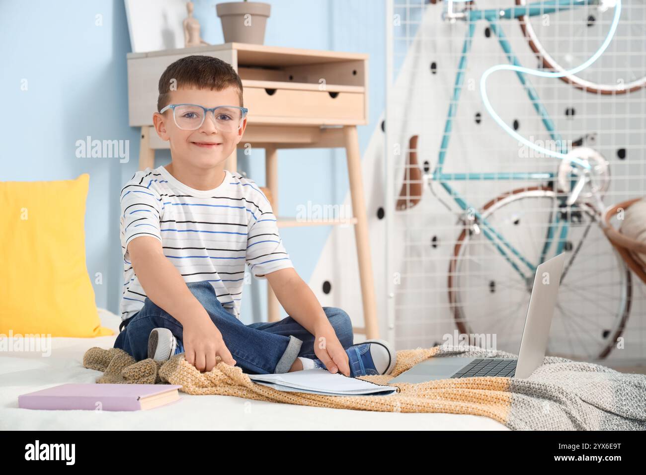 Cute little boy studying in bedroom Stock Photo - Alamy