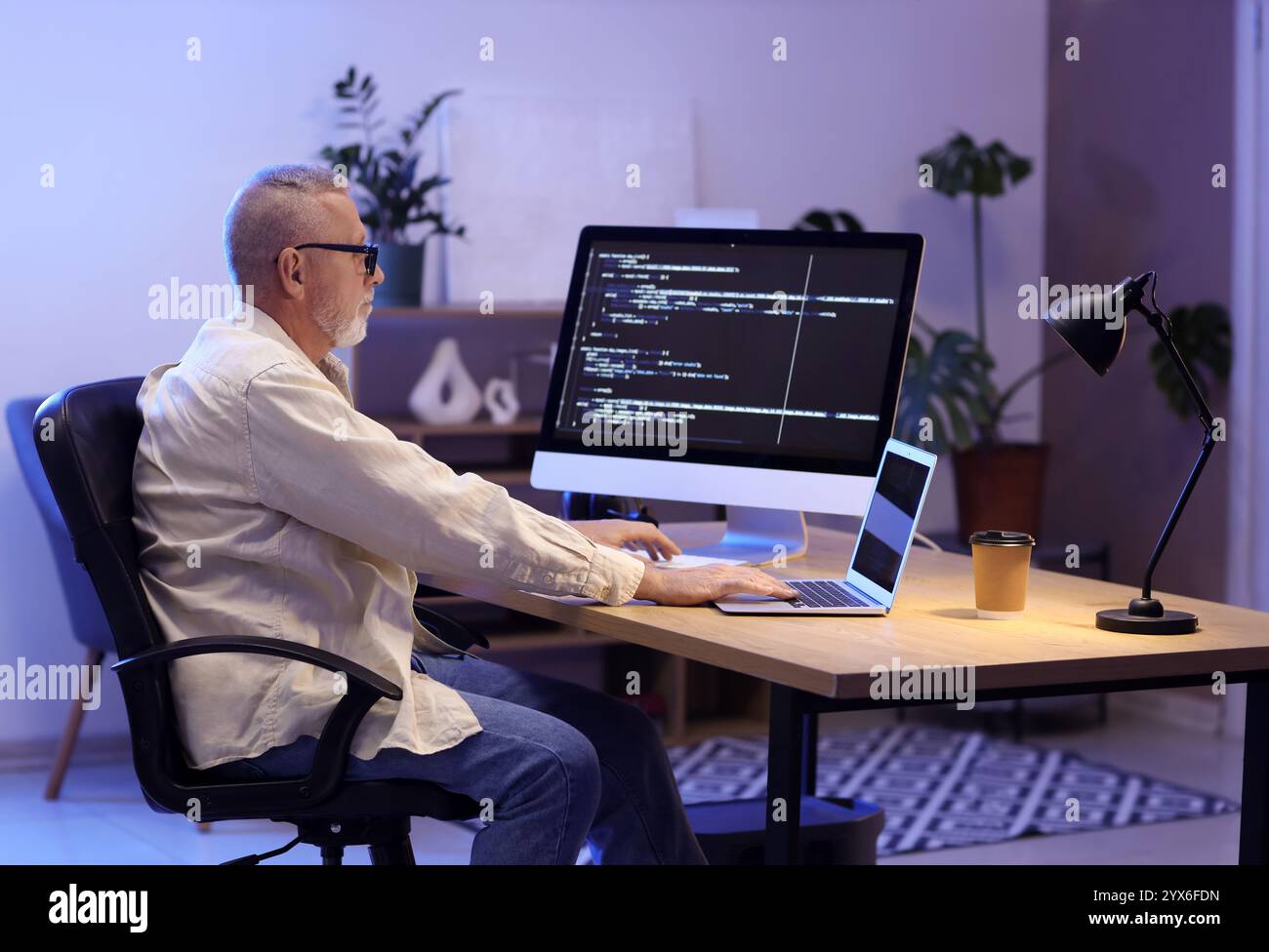 Elderly man working night office hi-res stock photography and images ...