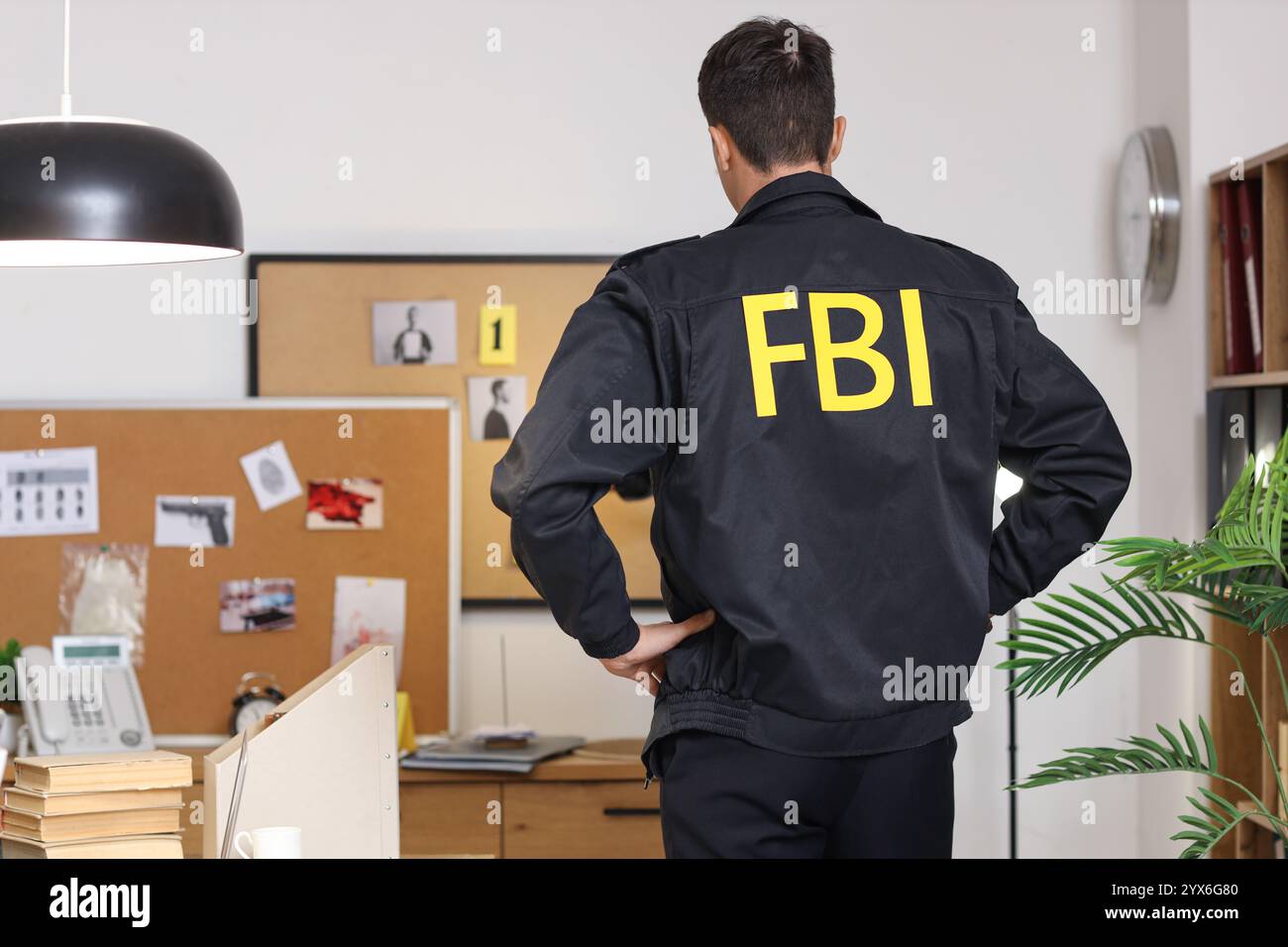 Male FBI agent in office, back view Stock Photo - Alamy