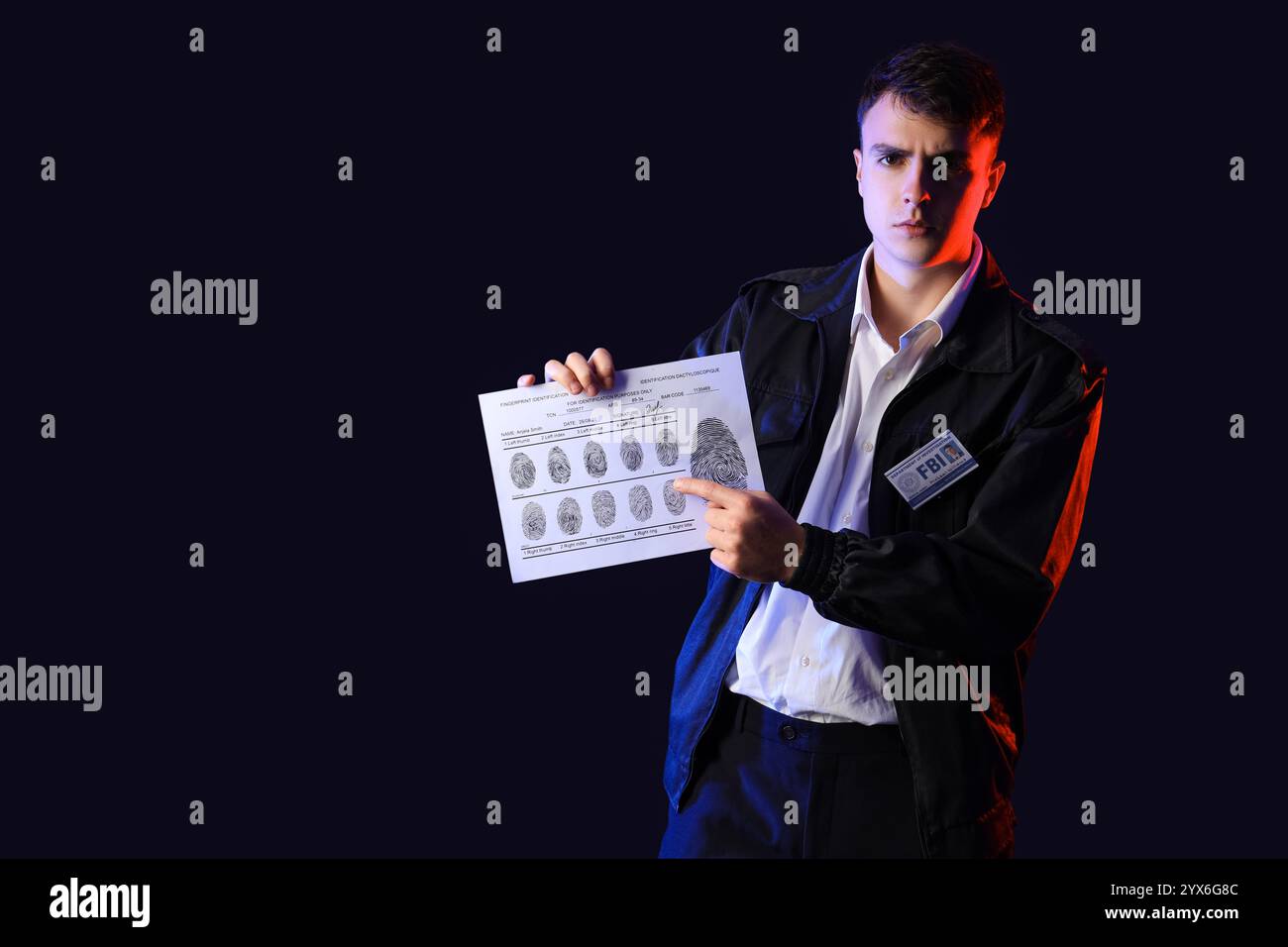 Male FBI agent with fingerprints on dark background Stock Photo - Alamy