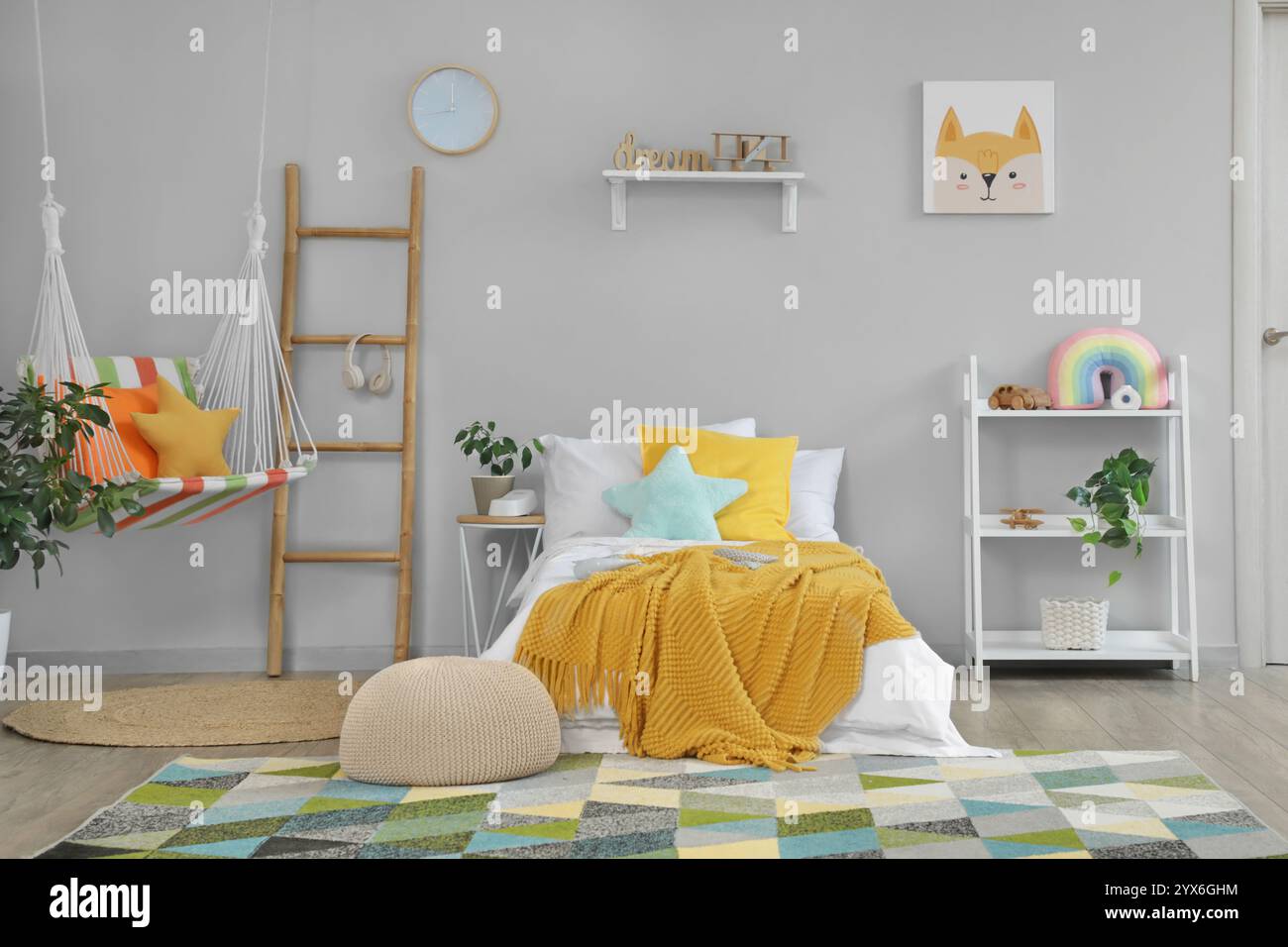 Interior of light children's room with bed, shelf unit and ladder Stock ...