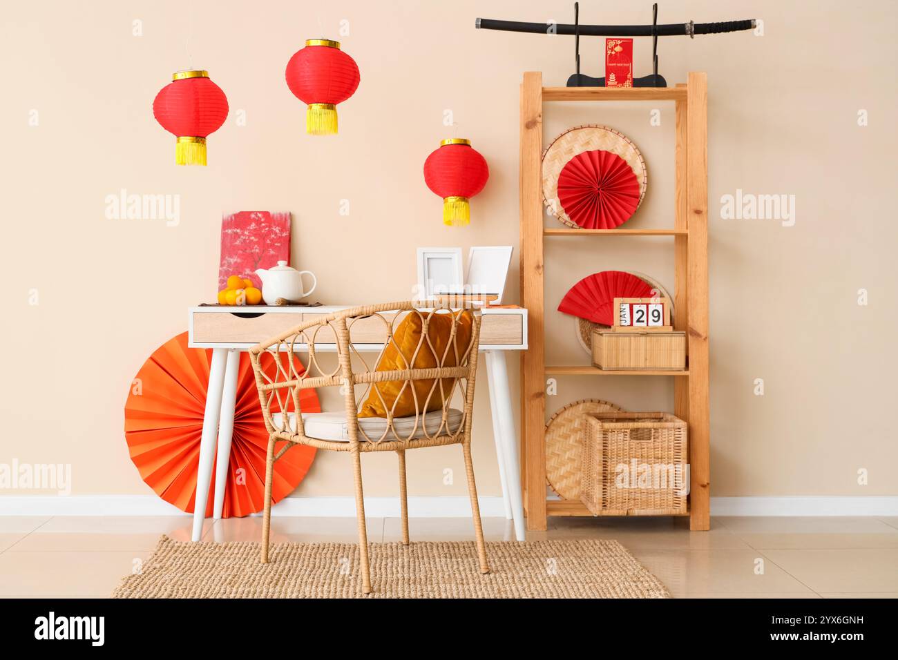 Interior of room decorated for Chinese New Year with desk and shelf ...