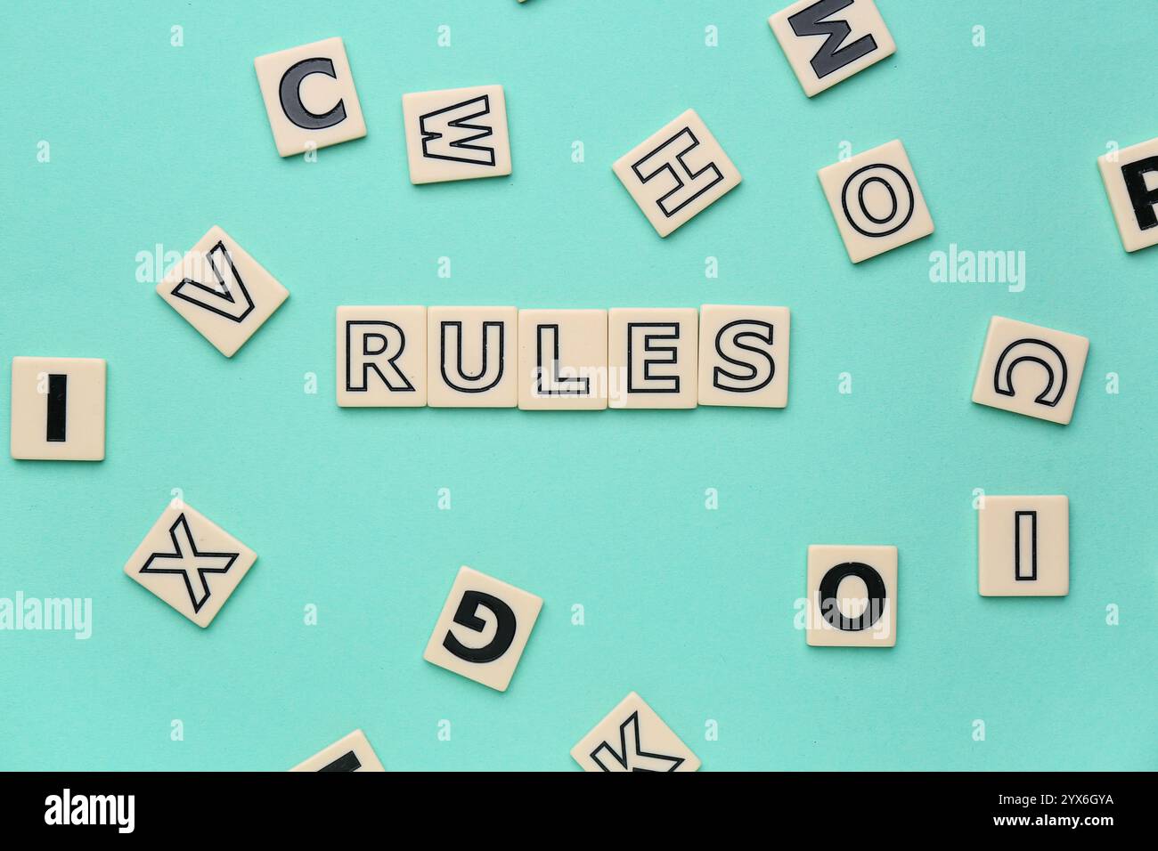 Word RULES with letters on turquoise background Stock Photo - Alamy