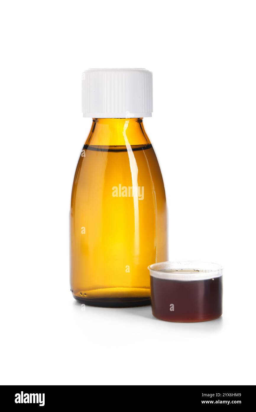 Bottle and measuring cup of cough syrup on white background Stock Photo ...
