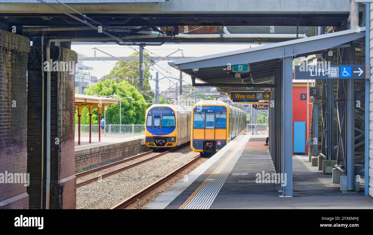 Arncliffe, Sydney, NSW - 5 October 2024: Two trains passing each other as they transit Arncliffe ...
