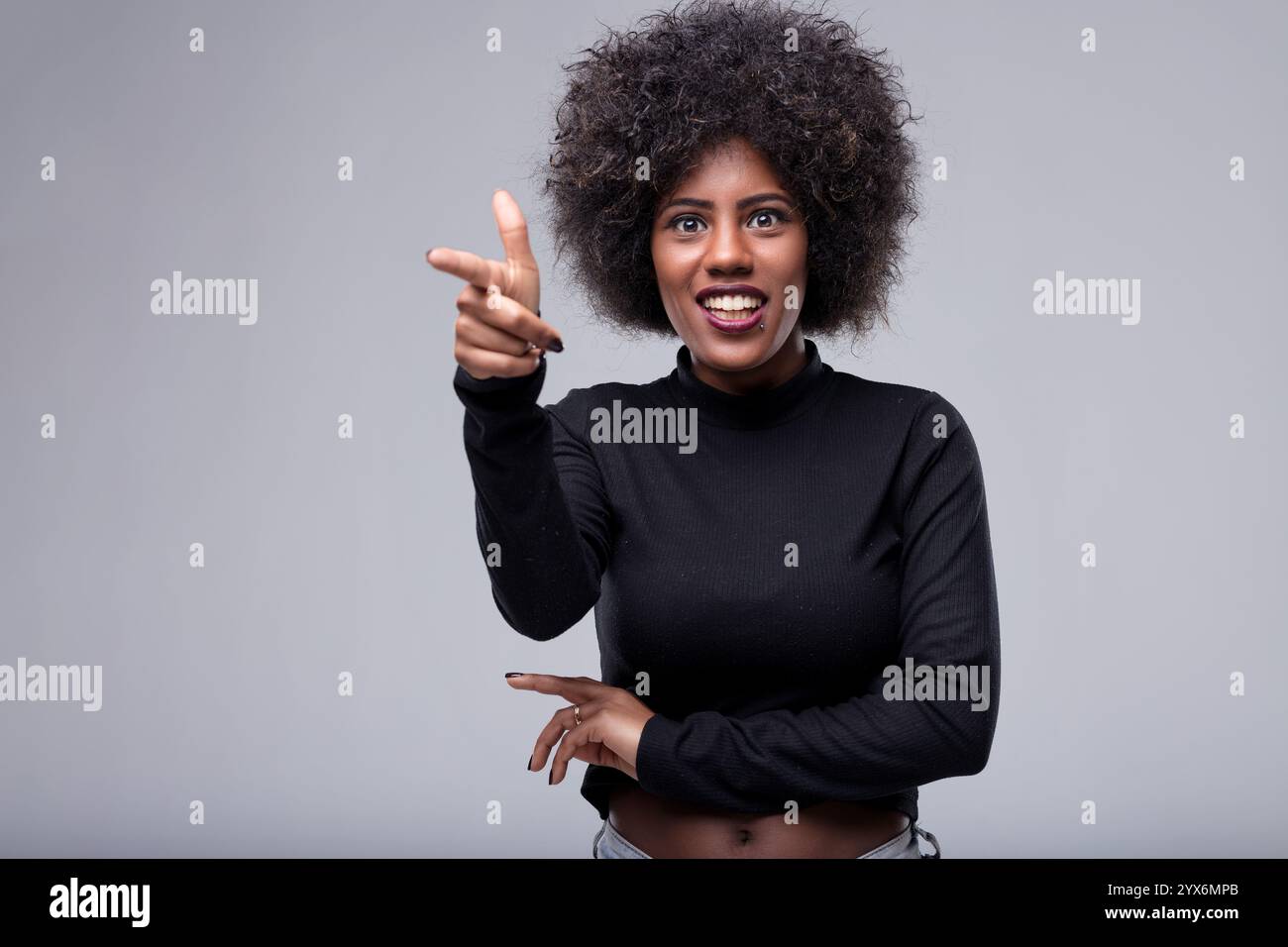 Woman pointing a gun at the camera hi-res stock photography and images ...