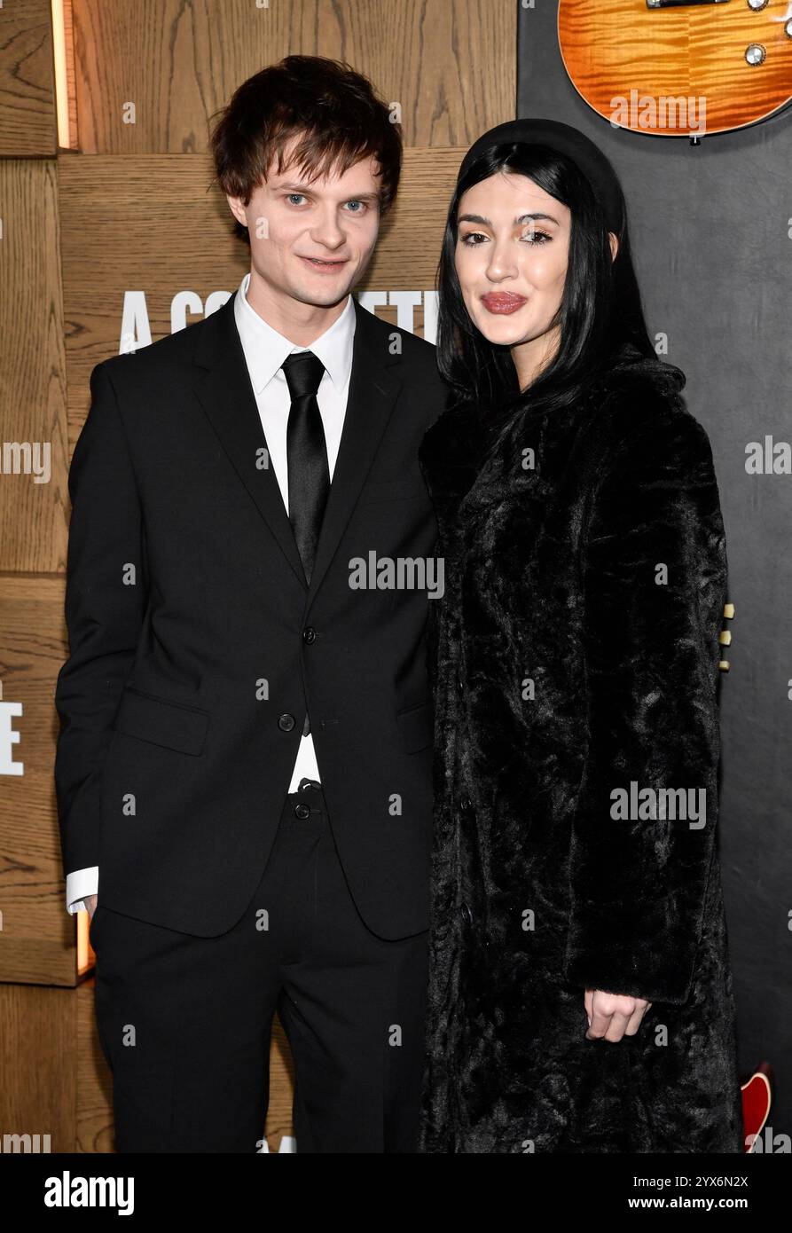 Charlie Tahan, left, and guest attend the premiere of "A Complete ...