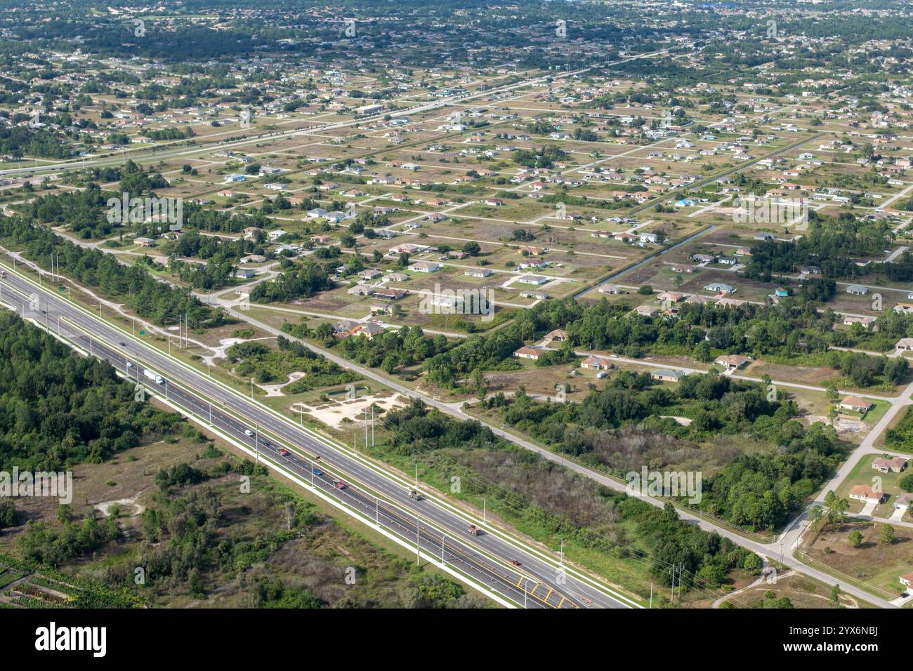 Florida. Aerial view of middle-class neighborhood with empty lots yet ...