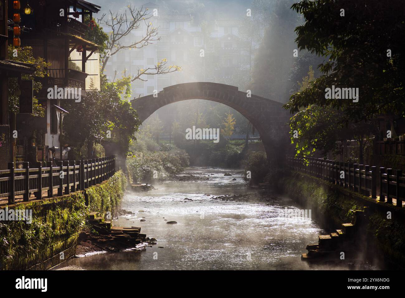 Shangli Ancient Town in Sichuan, with ancient bridge and morning mist ...