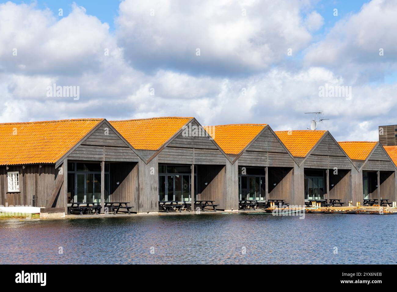 Waterfront timber houses with small decks and outside space on ...
