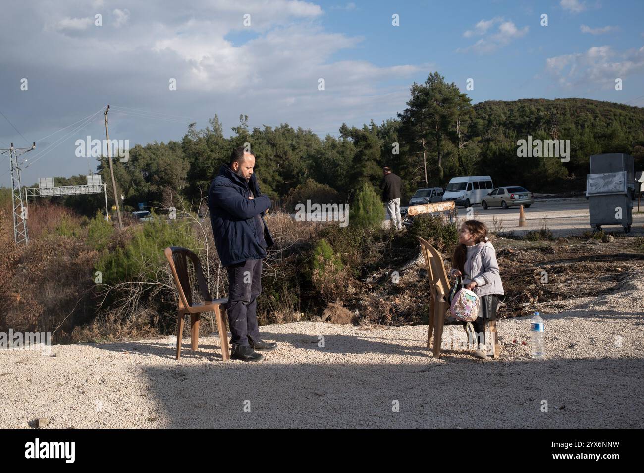A Syrian man prays in front of the Yayladagi border gate. On December 8, 2024, Islamist-led ...